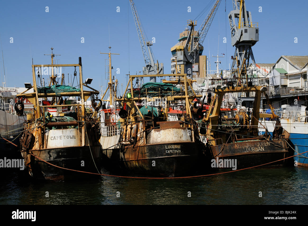 Commercial fishing fleet boats berthed hi-res stock photography and ...