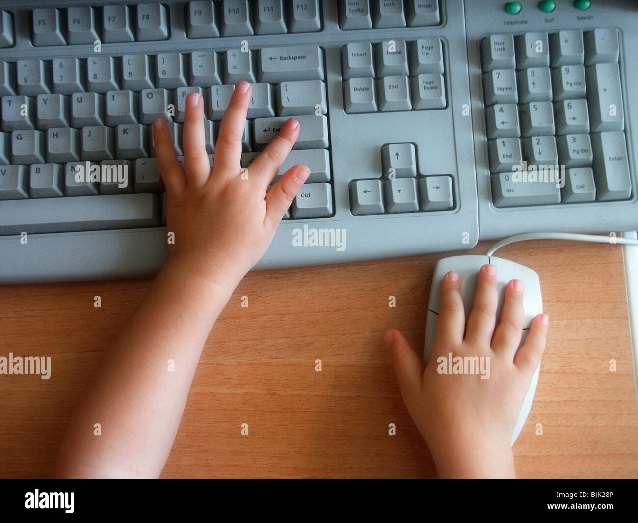 Children using computer mouse hi-res stock photography and images - Alamy