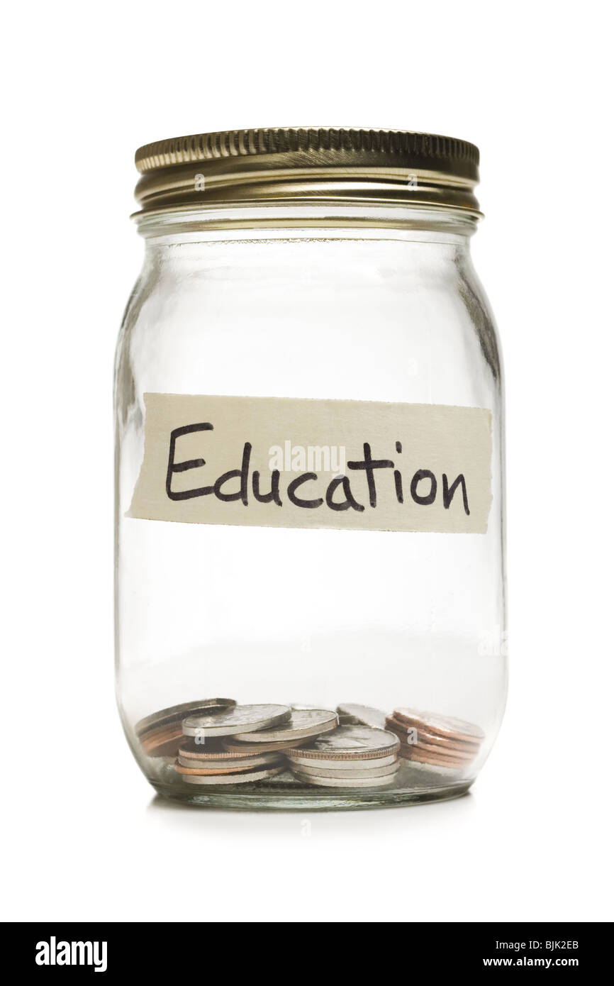 Glass jar with change and Savings label Stock Photo - Alamy