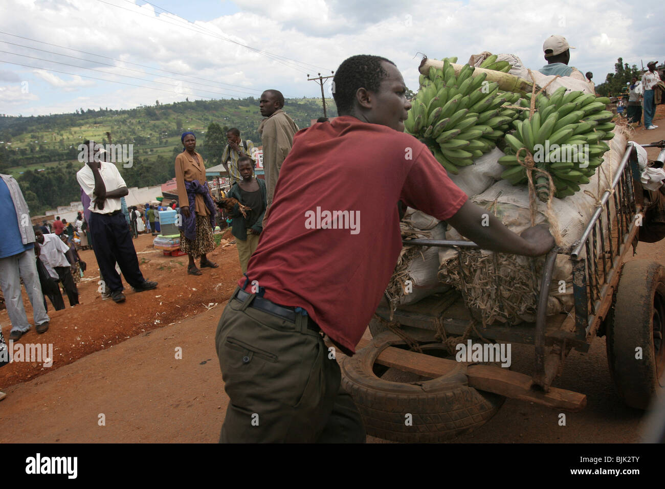 Man pushing food cart Village market Kenya Stock Photo - Alamy