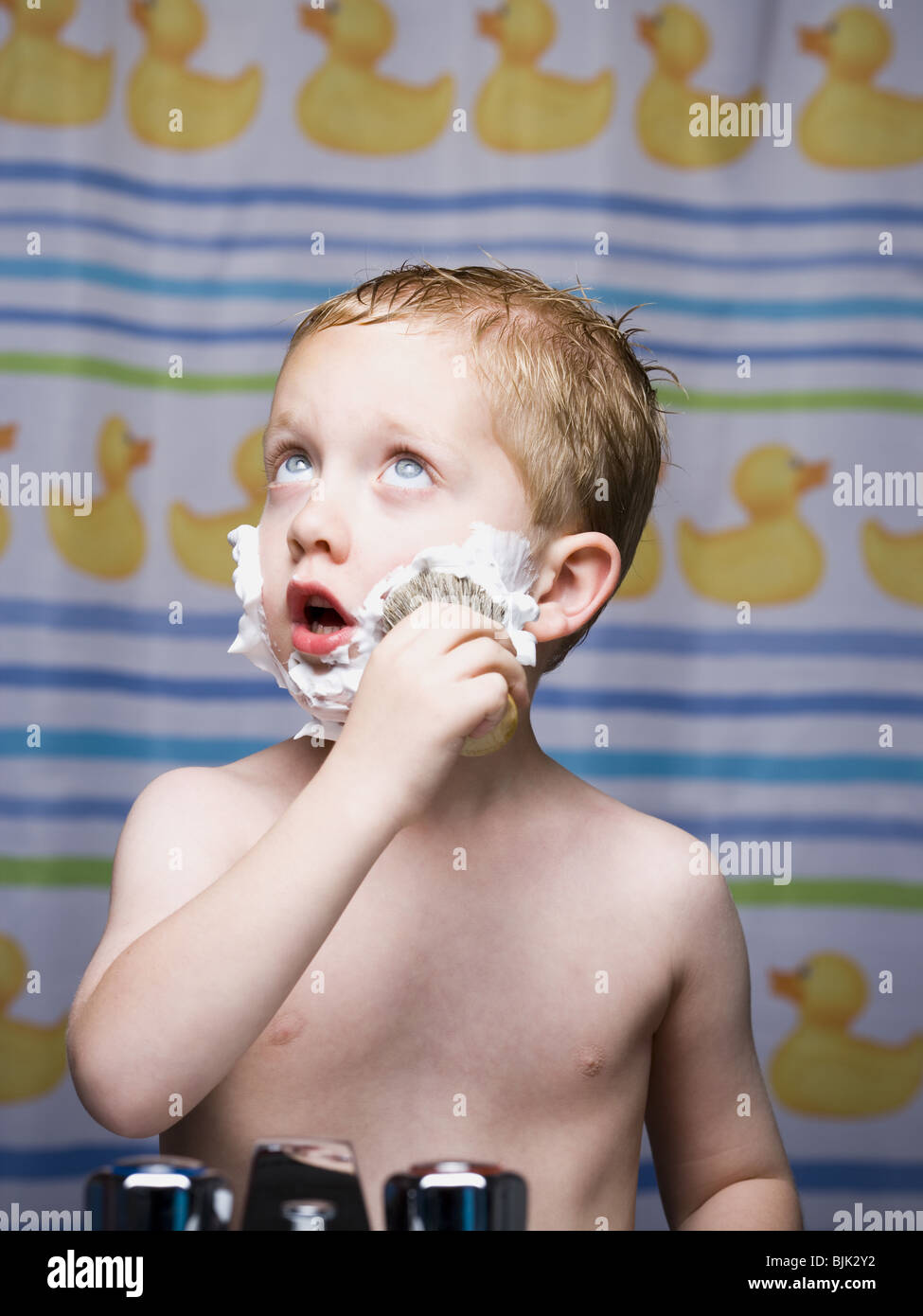 Boy shaving in bathroom Stock Photo - Alamy