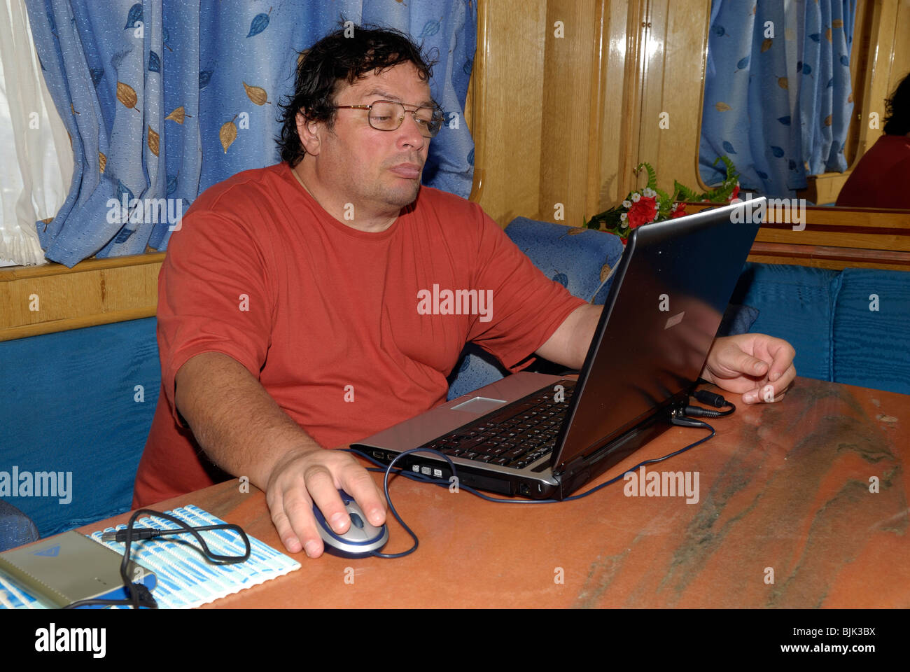 Organizing his shots with a software hi-res stock photography and ...