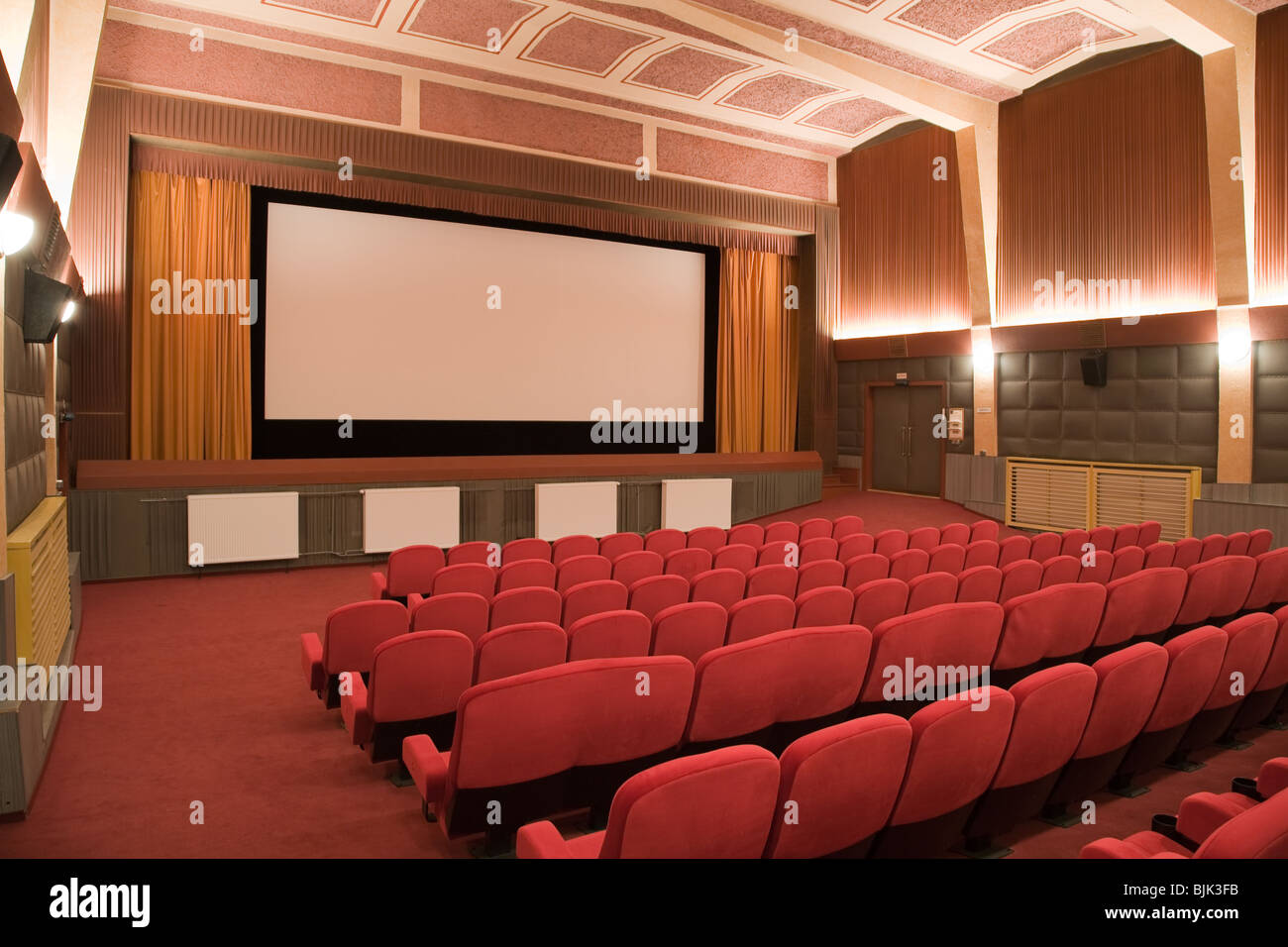 Empty retro cinema auditorium in cubism style with line of chairs and ...