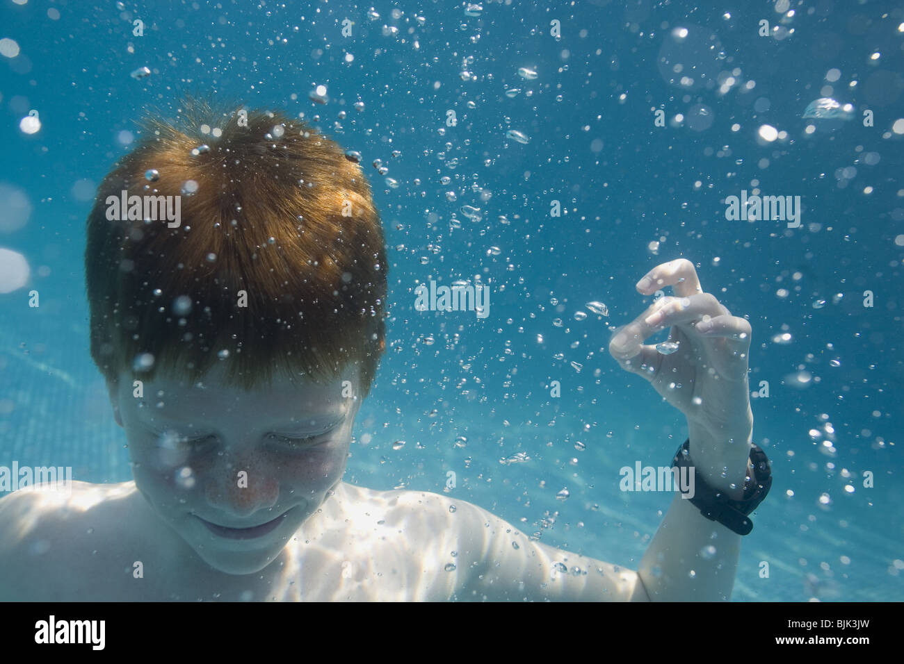Boy meditating underwater Stock Photo - Alamy