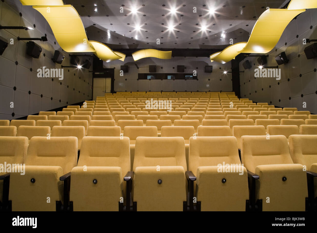 Interior of cinema auditorium with yellow chairs Stock Photo - Alamy