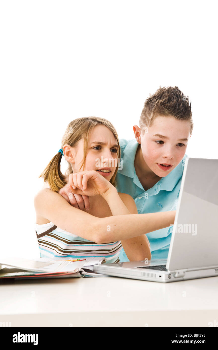 Boy and girl learning together with a computer Stock Photo - Alamy