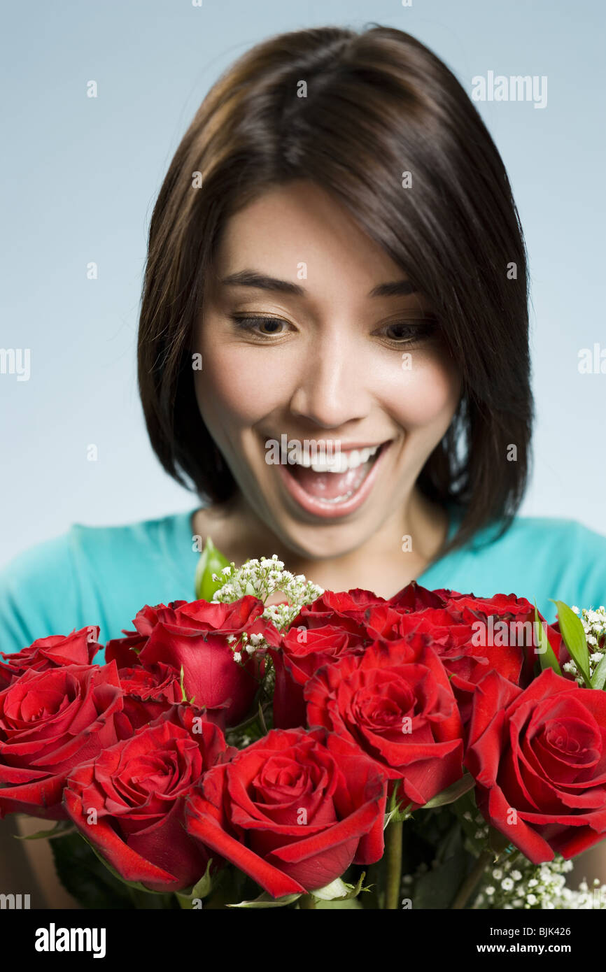 Excited woman with red roses Stock Photo - Alamy