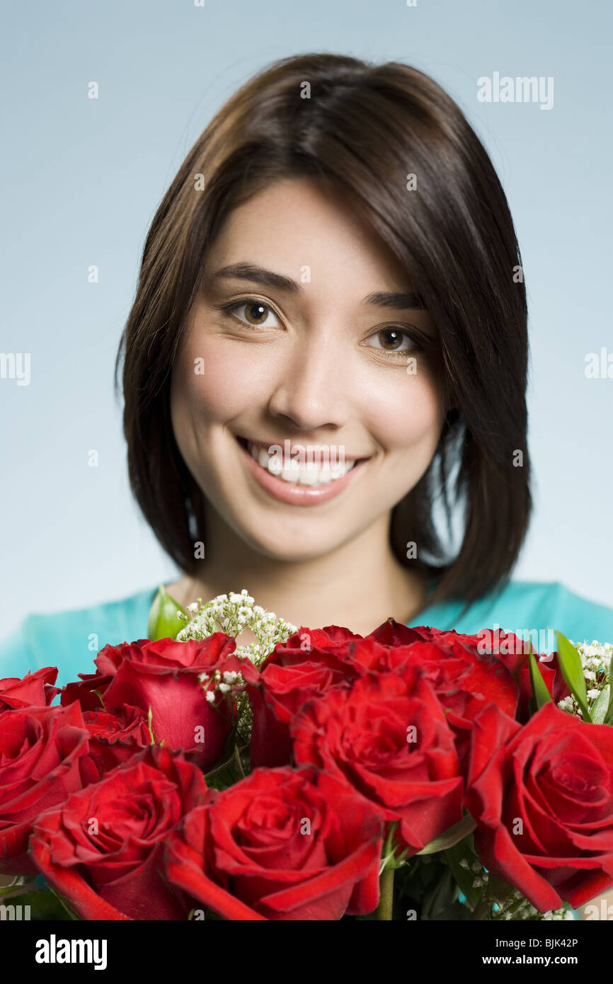 Excited woman with red roses Stock Photo - Alamy