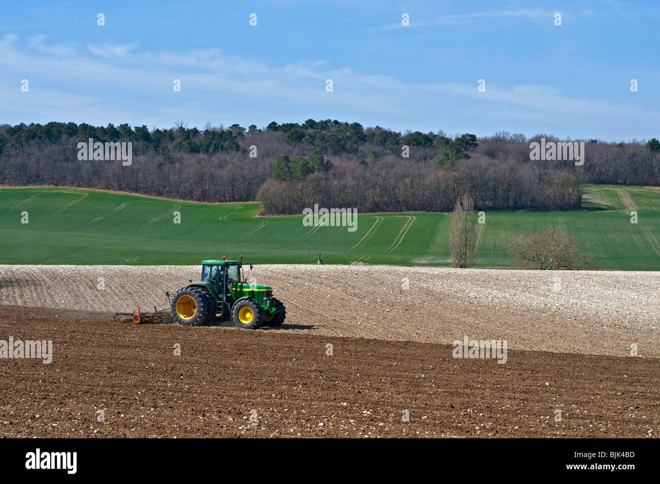 John Deere 7810 tractor and Harrow - France Stock Photo - Alamy