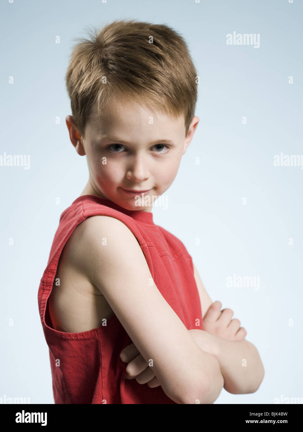 Portrait of a boy making hand gesture smiling Stock Photo - Alamy