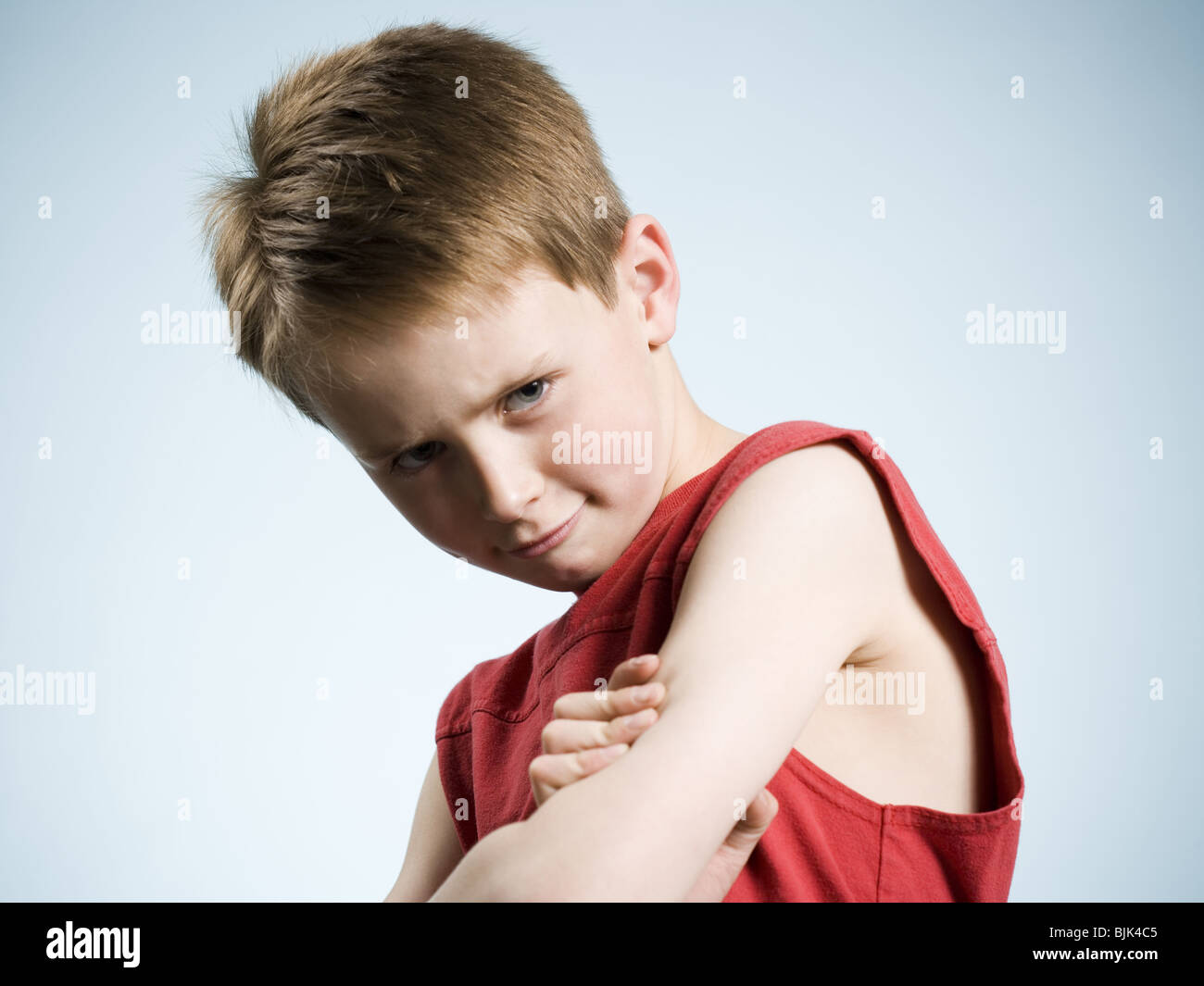 Portrait of a boy making hand gesture smiling Stock Photo - Alamy