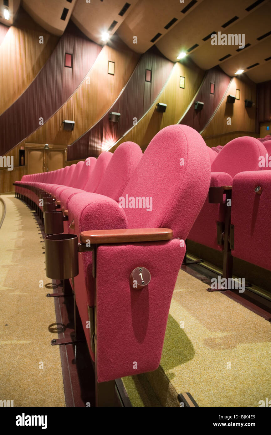 Row #1 in cinema auditorium with walls and ceiling decoration and line ...