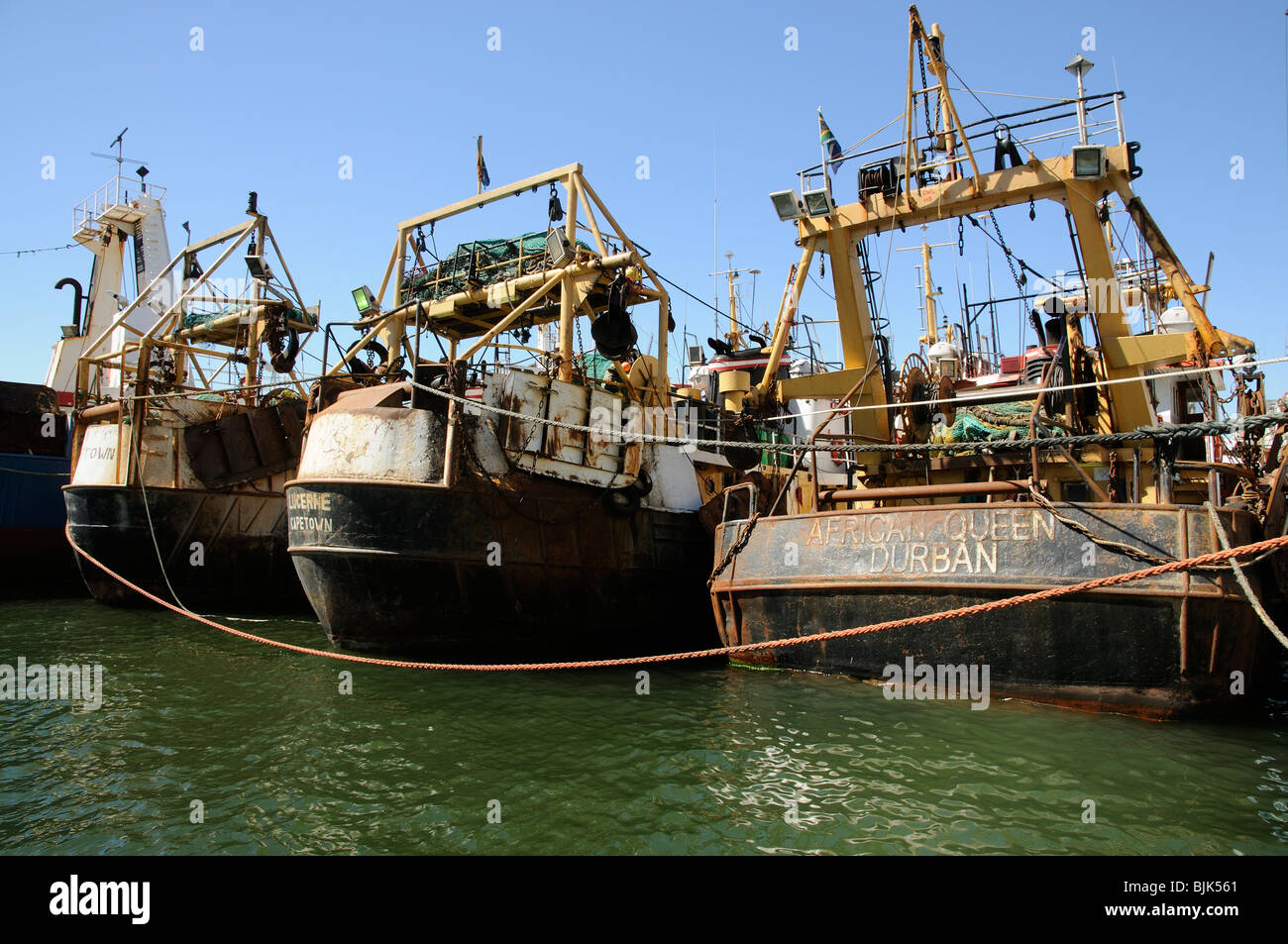 Commercial fishing fleet boats berthed in the port of Cape Town South ...