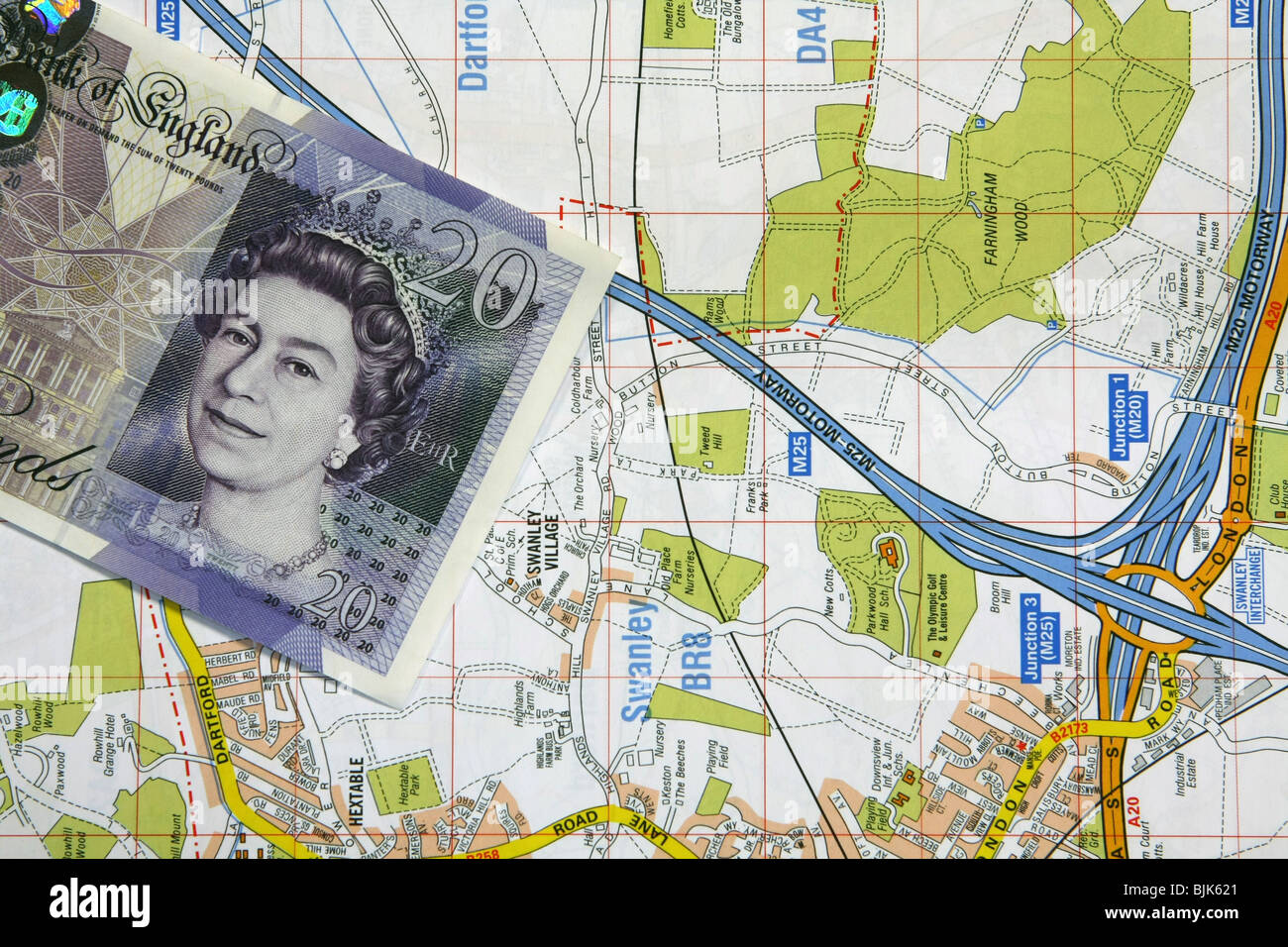 a £20 note on a page of an open road map Stock Photo - Alamy