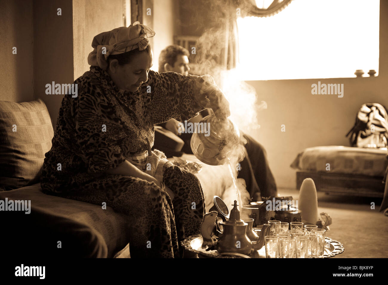 This is an image of an old Berber woman make traditional Moroccan mint ...
