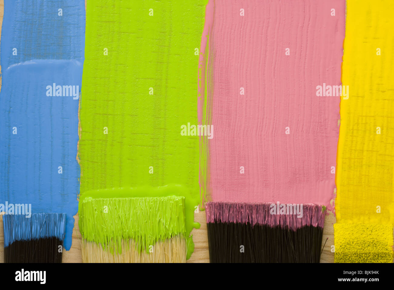 Four paint brushes with stripes of paint Stock Photo - Alamy