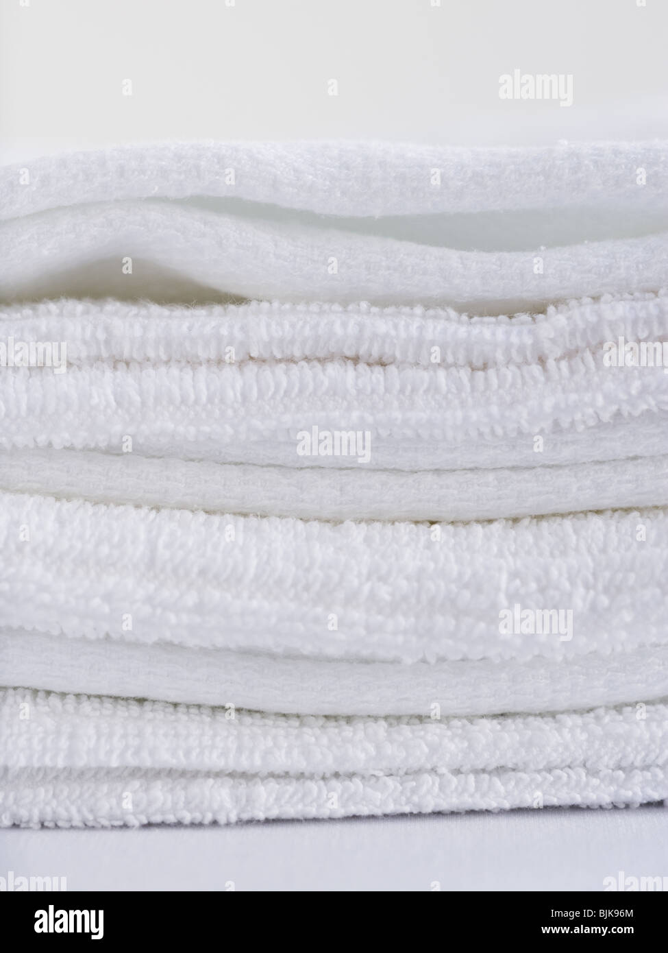 Stack of white towels Stock Photo - Alamy