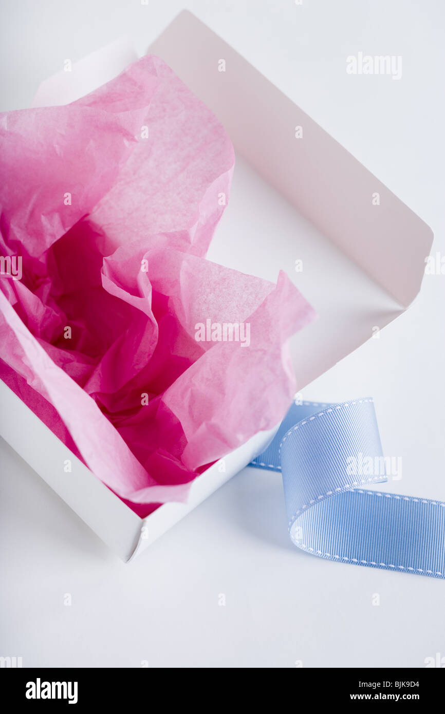 Empty candy box with tissue and ribbon Stock Photo - Alamy