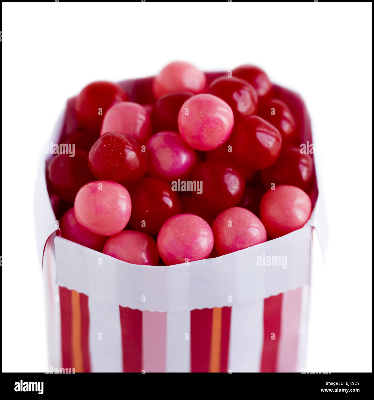 Candy box with pink and red candies Stock Photo - Alamy