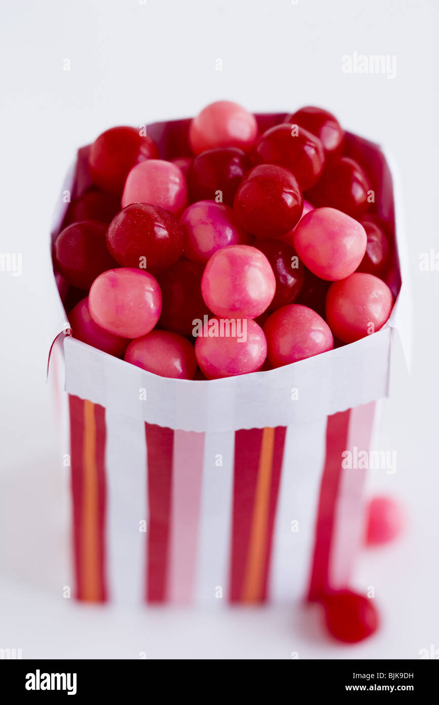 Candy box with pink and red candies Stock Photo - Alamy