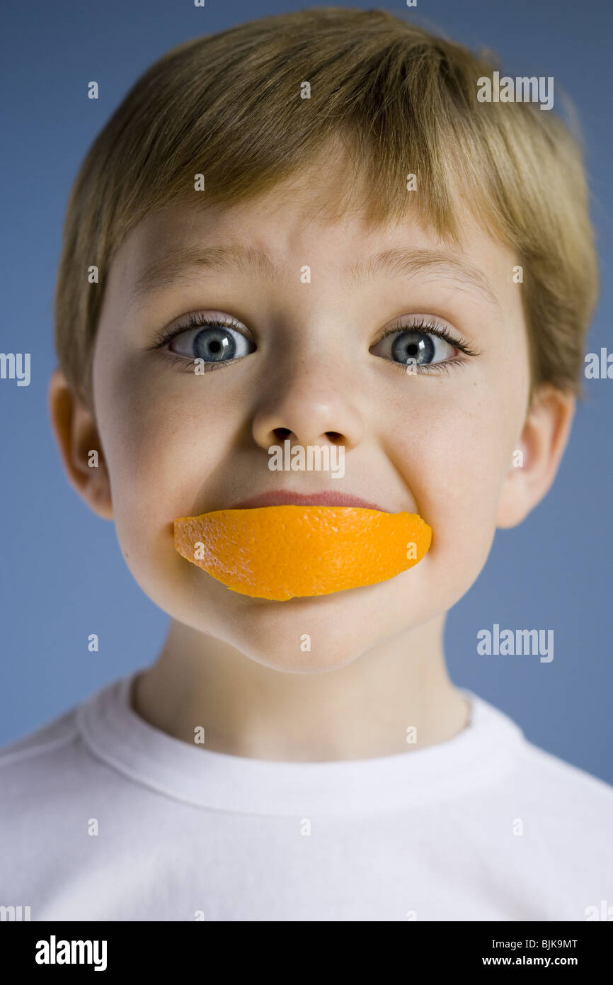 Boy With Orange Wedge High Resolution Stock Photography and Images - Alamy