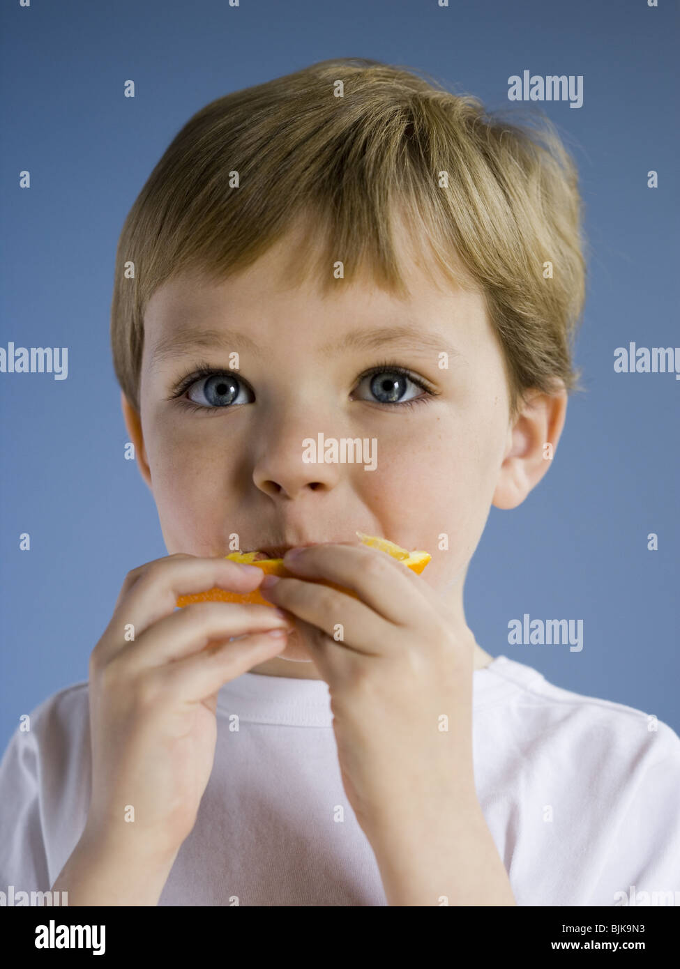 Boy holding oranges hi-res stock photography and images - Alamy