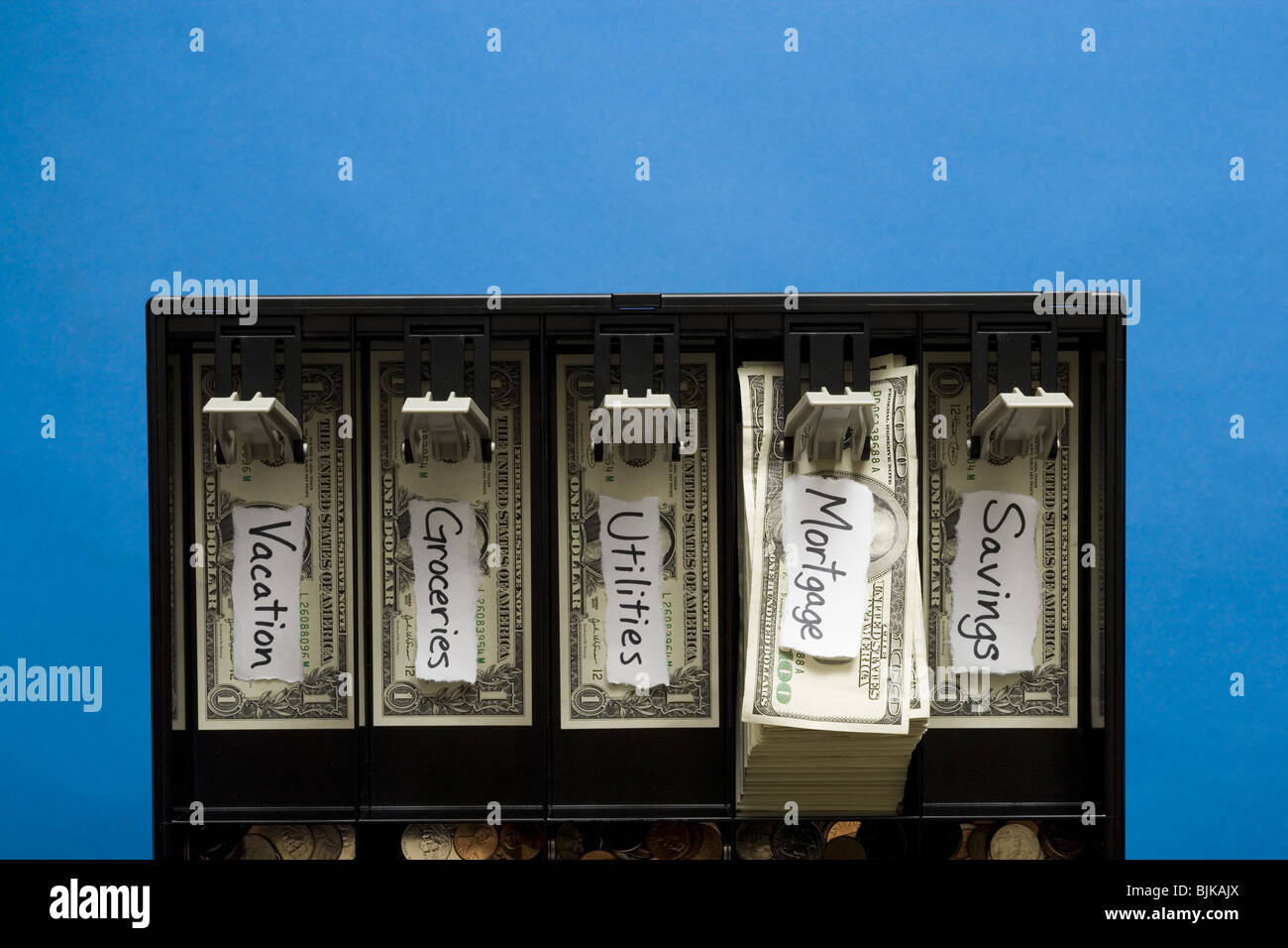 Detailed view of US currency and coins in till with labels for ...