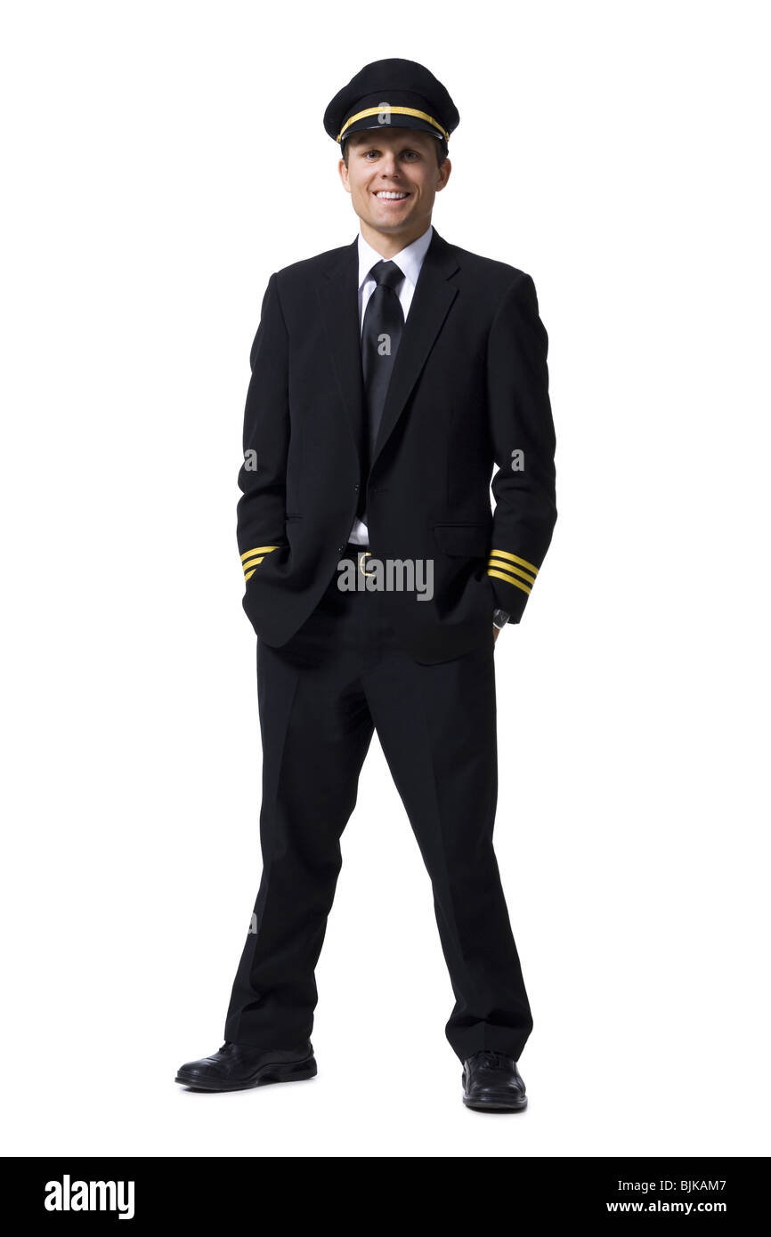 Pilot standing with arms crossed smiling Stock Photo - Alamy