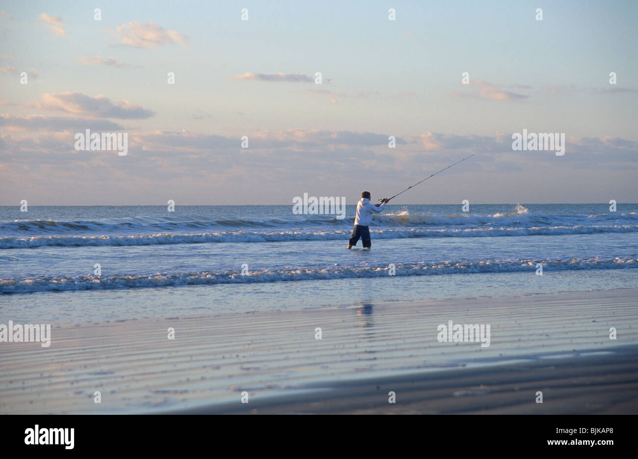 Boy of about 14 tossing his fishing line into the ocean, Cocoa Beach ...