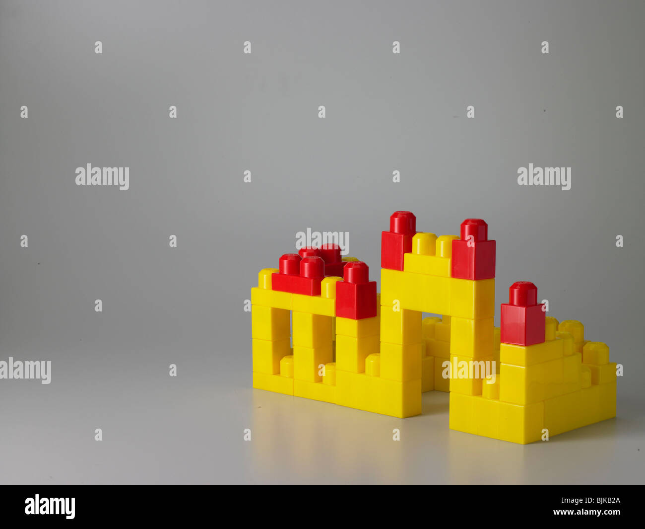 Toy blocks showing building and structure. Low angle Stock Photo - Alamy