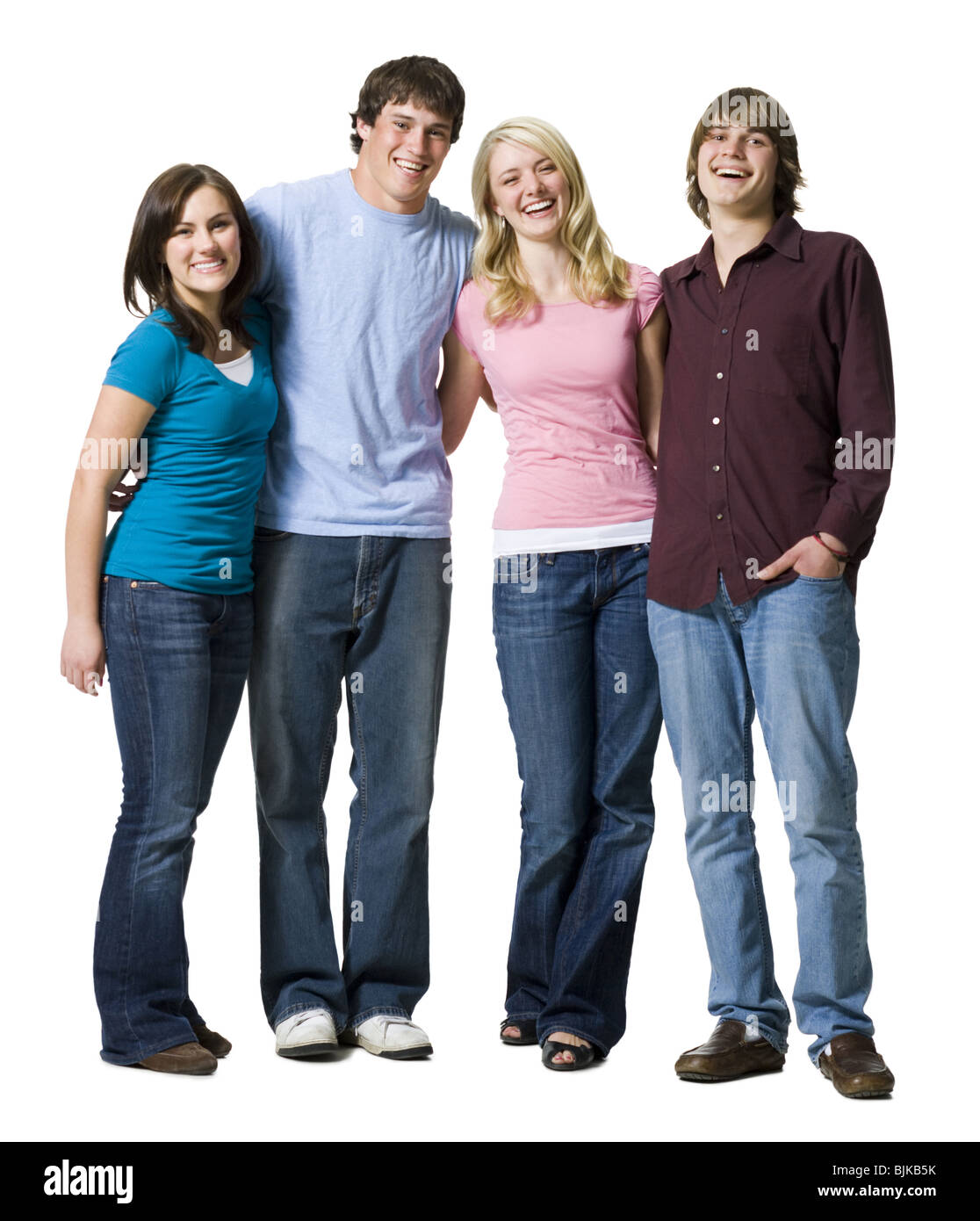 Four people smiling Stock Photo - Alamy