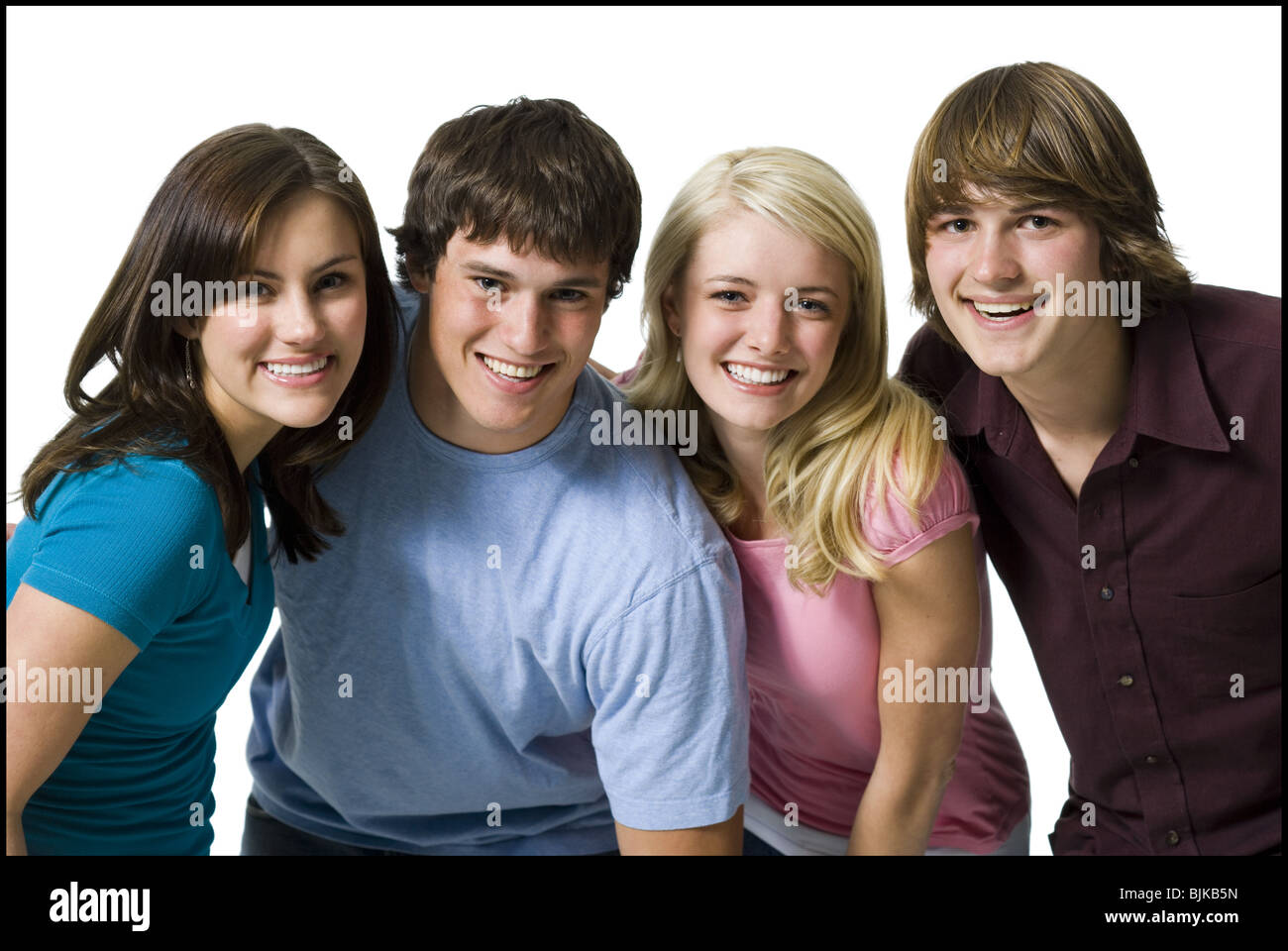 Four people smiling Stock Photo - Alamy