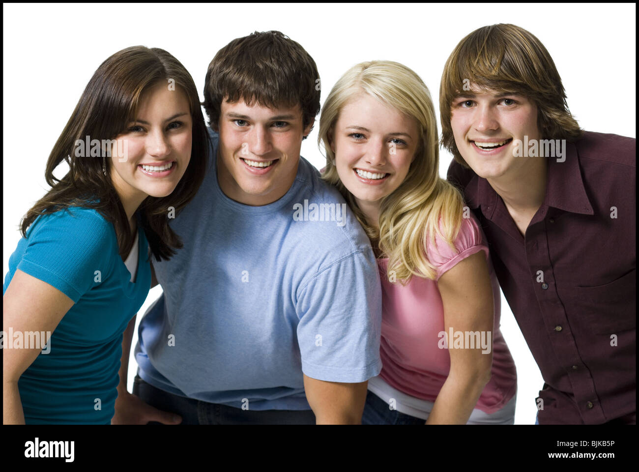 Four people smiling Stock Photo - Alamy