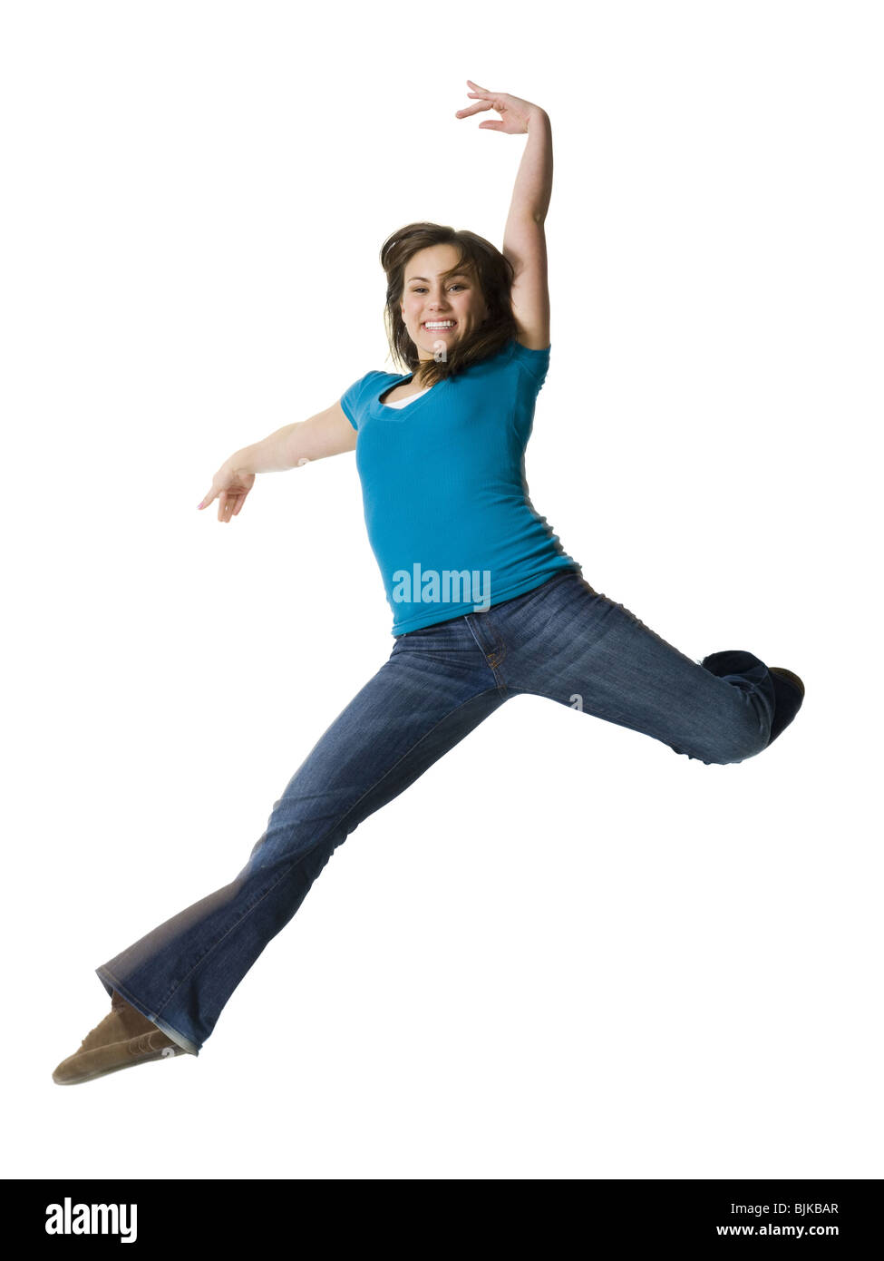 Female dancer leaping and smiling Stock Photo - Alamy