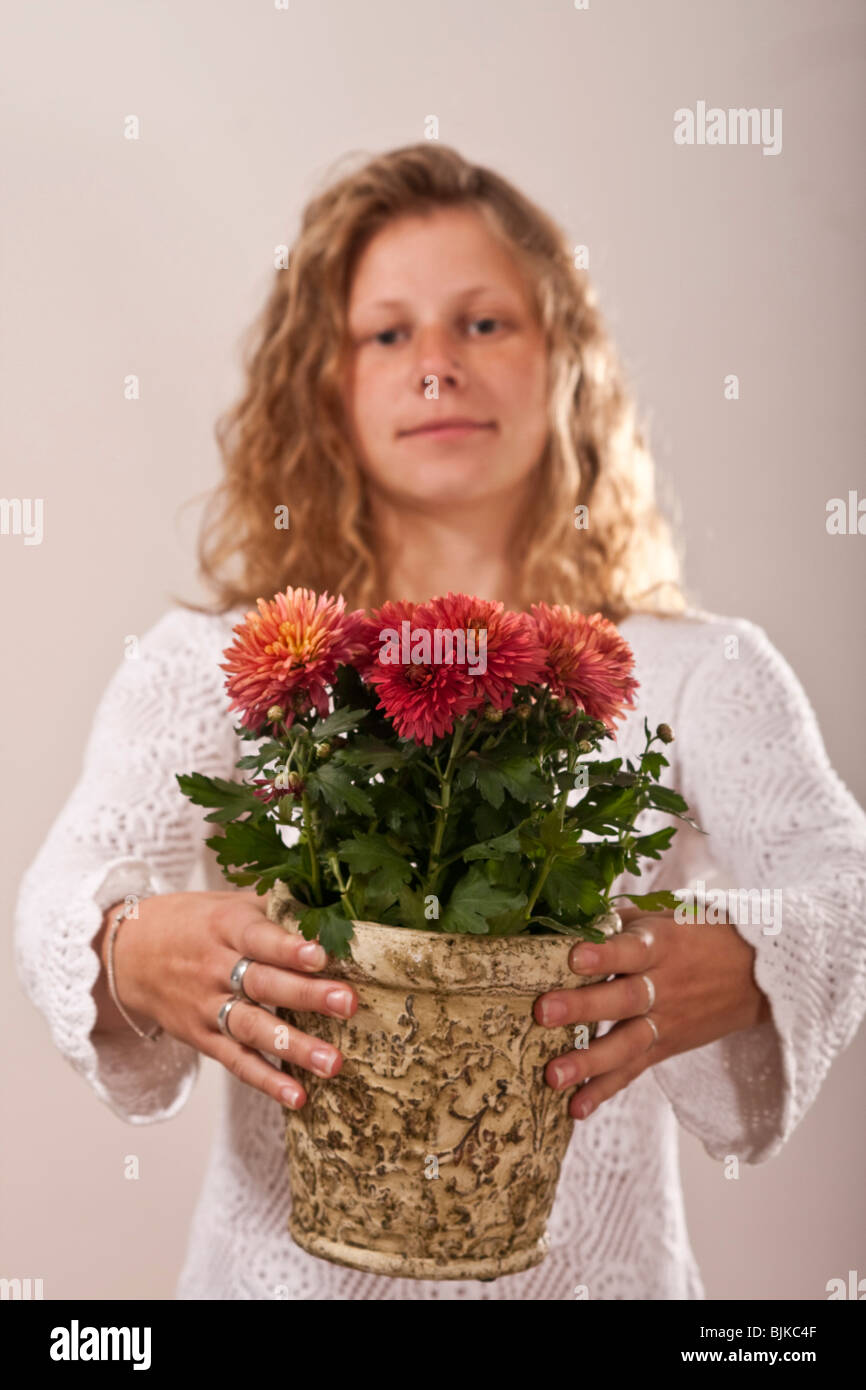 Woman with flower pot Stock Photo - Alamy