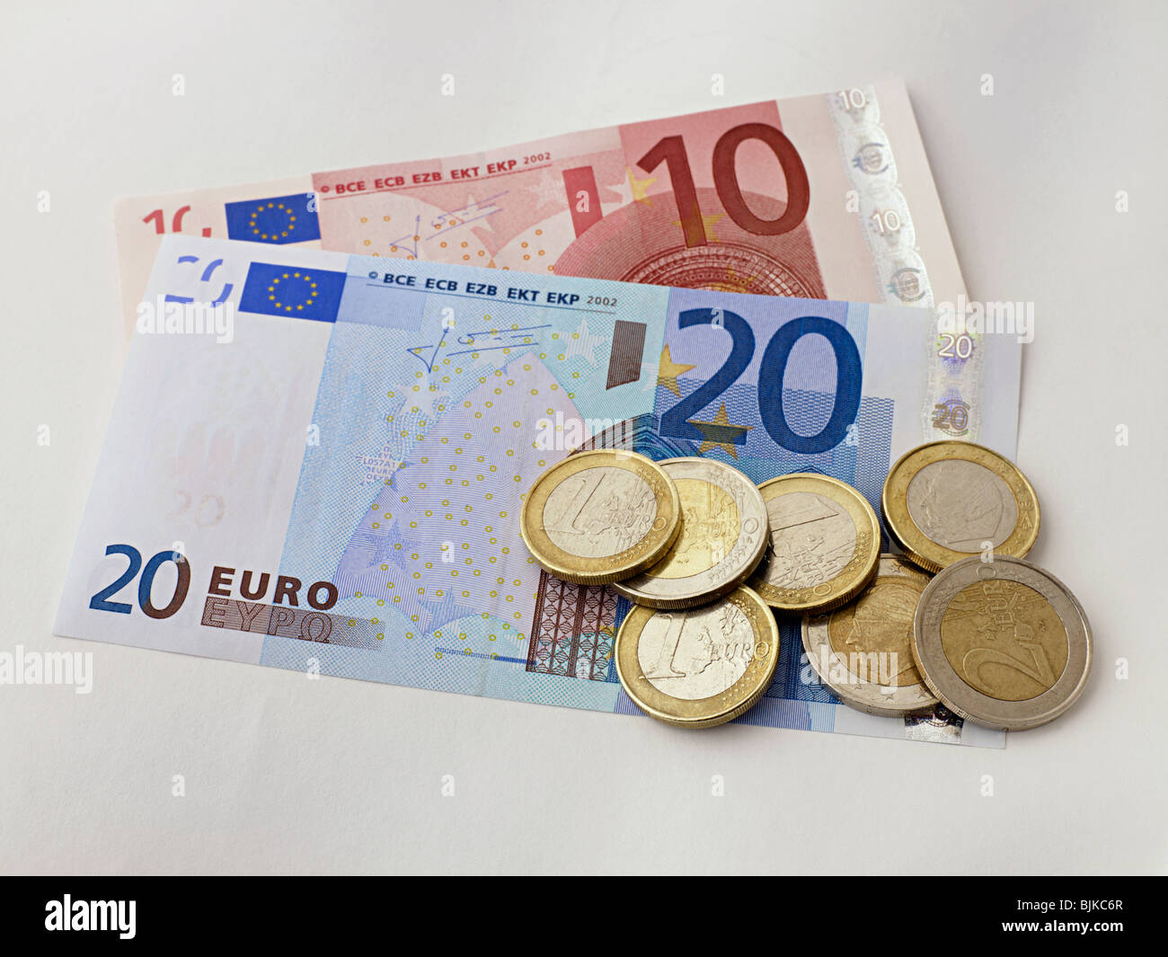 twenty and ten eoro notes with euro coins currency Stock Photo - Alamy