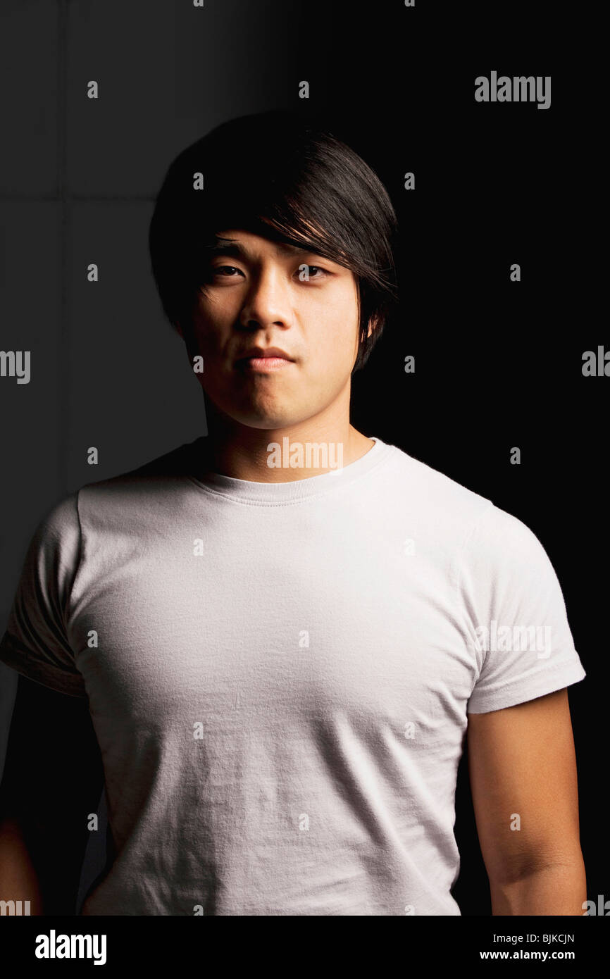 Muscular man with tensed arm looking hostile Stock Photo - Alamy