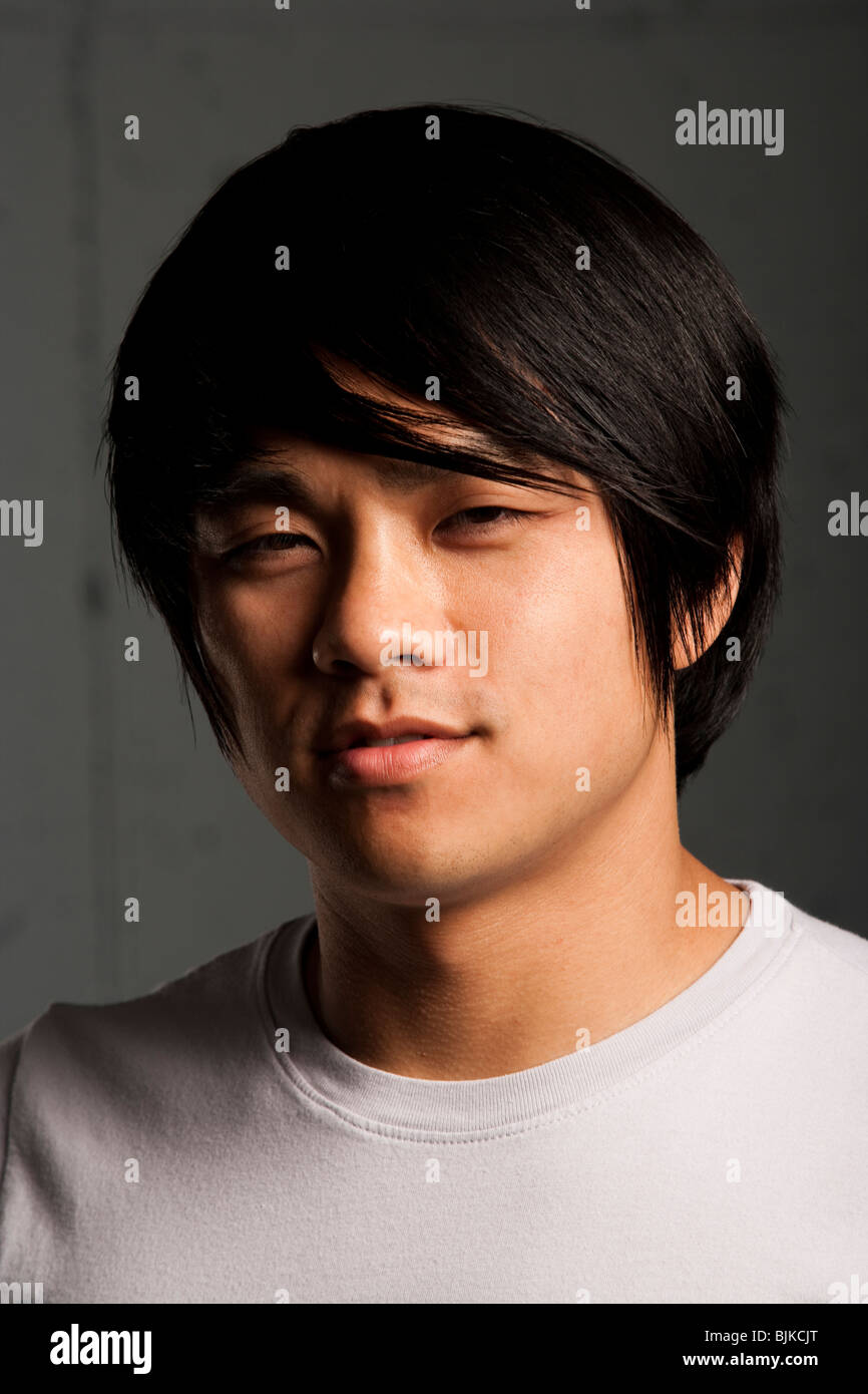 Muscular man with tensed arm looking hostile Stock Photo - Alamy