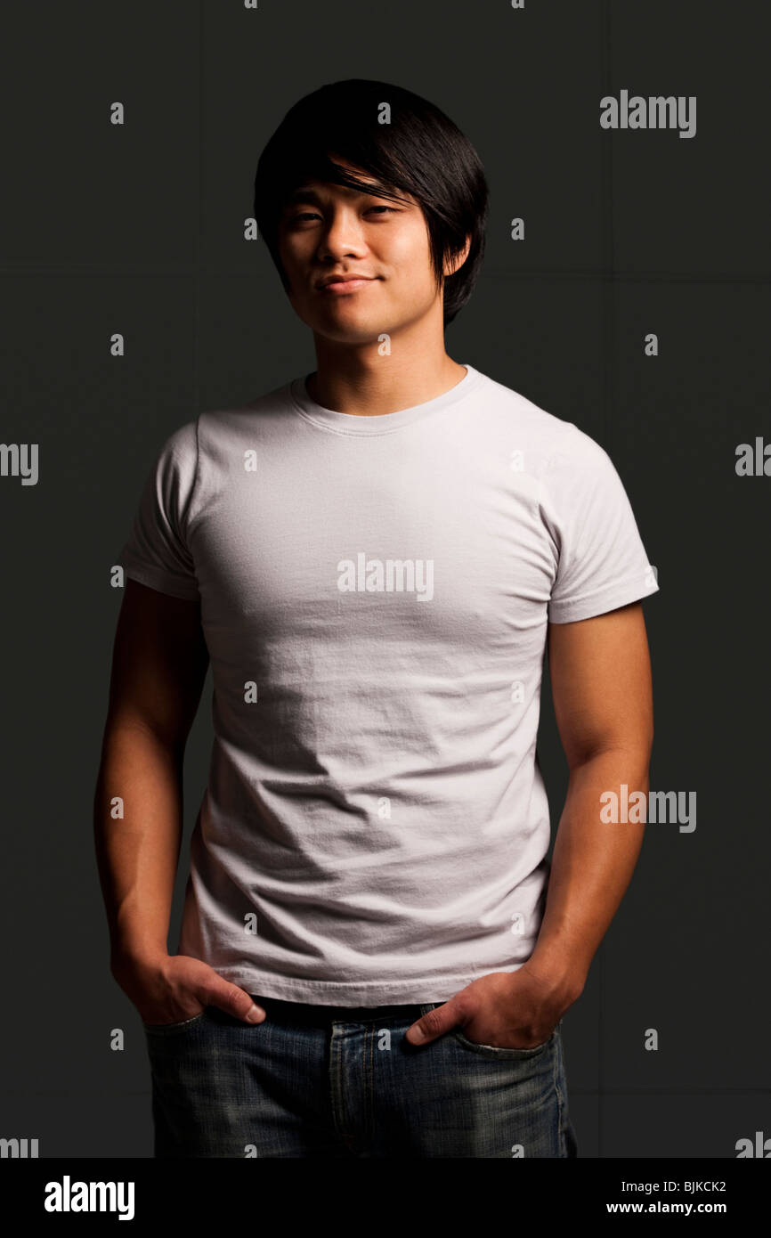Muscular man with eyeglasses smiling Stock Photo - Alamy