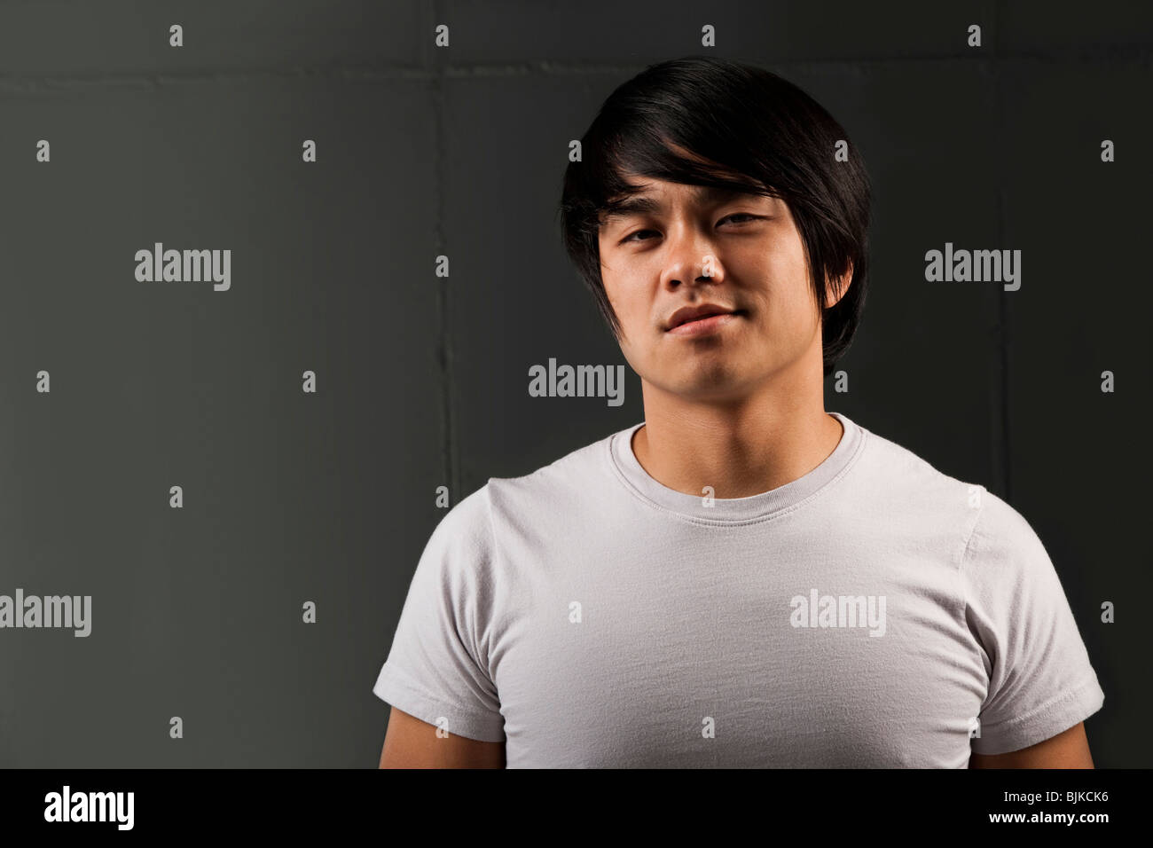 Muscular man with eyeglasses smiling Stock Photo - Alamy