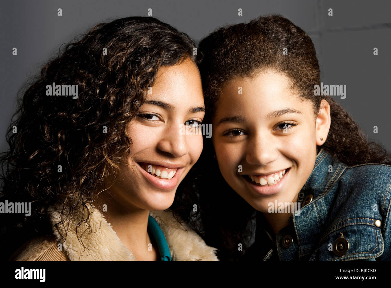 Two girls smiling Stock Photo - Alamy