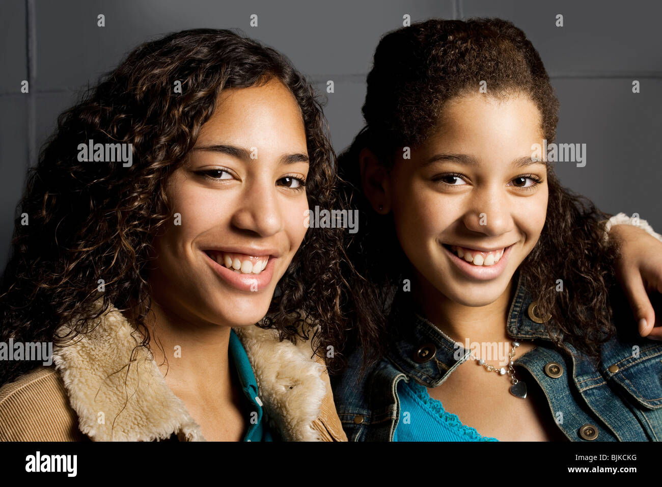 Two girls smiling Stock Photo - Alamy