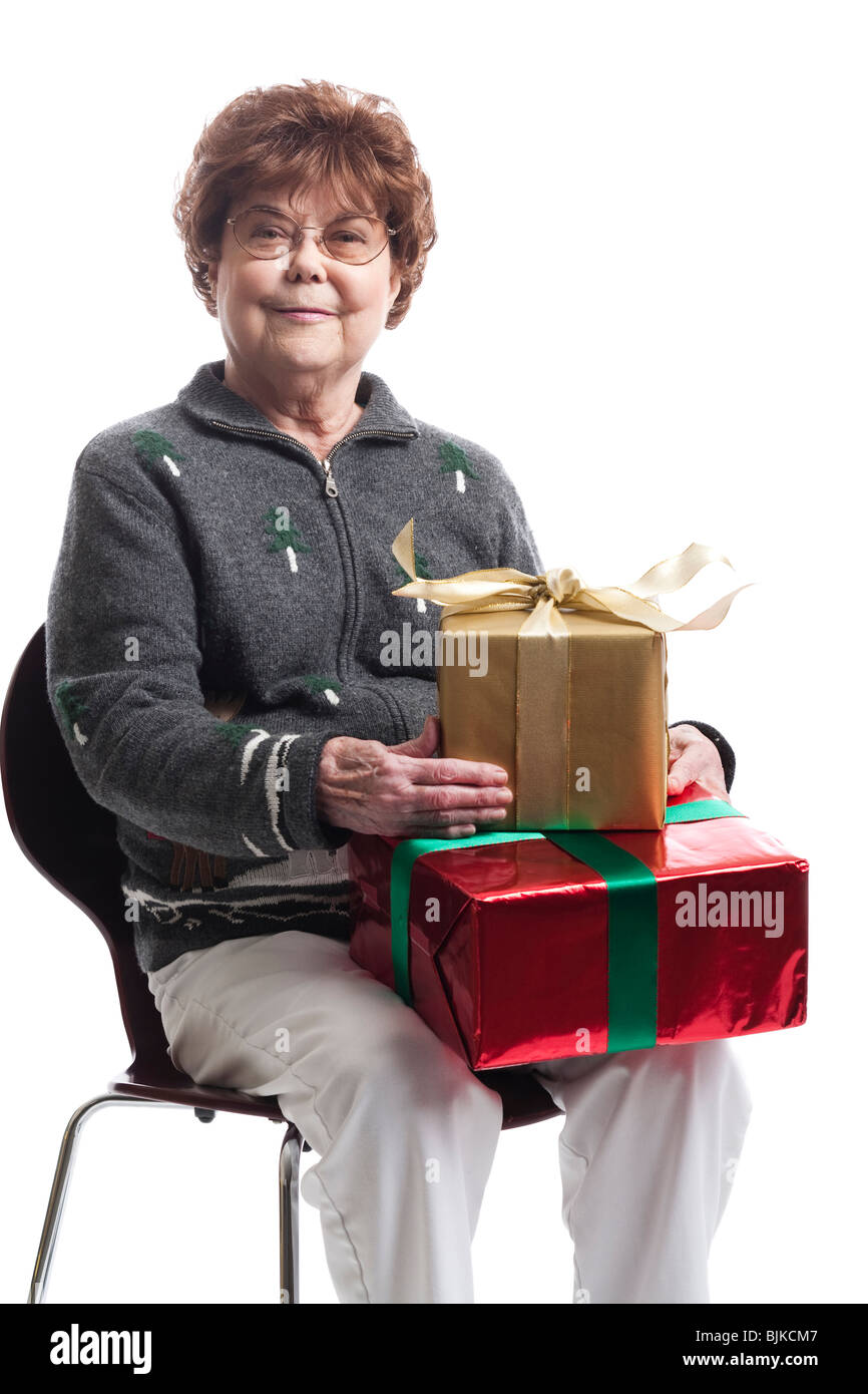 Mature woman receiving Christmas gifts Stock Photo - Alamy