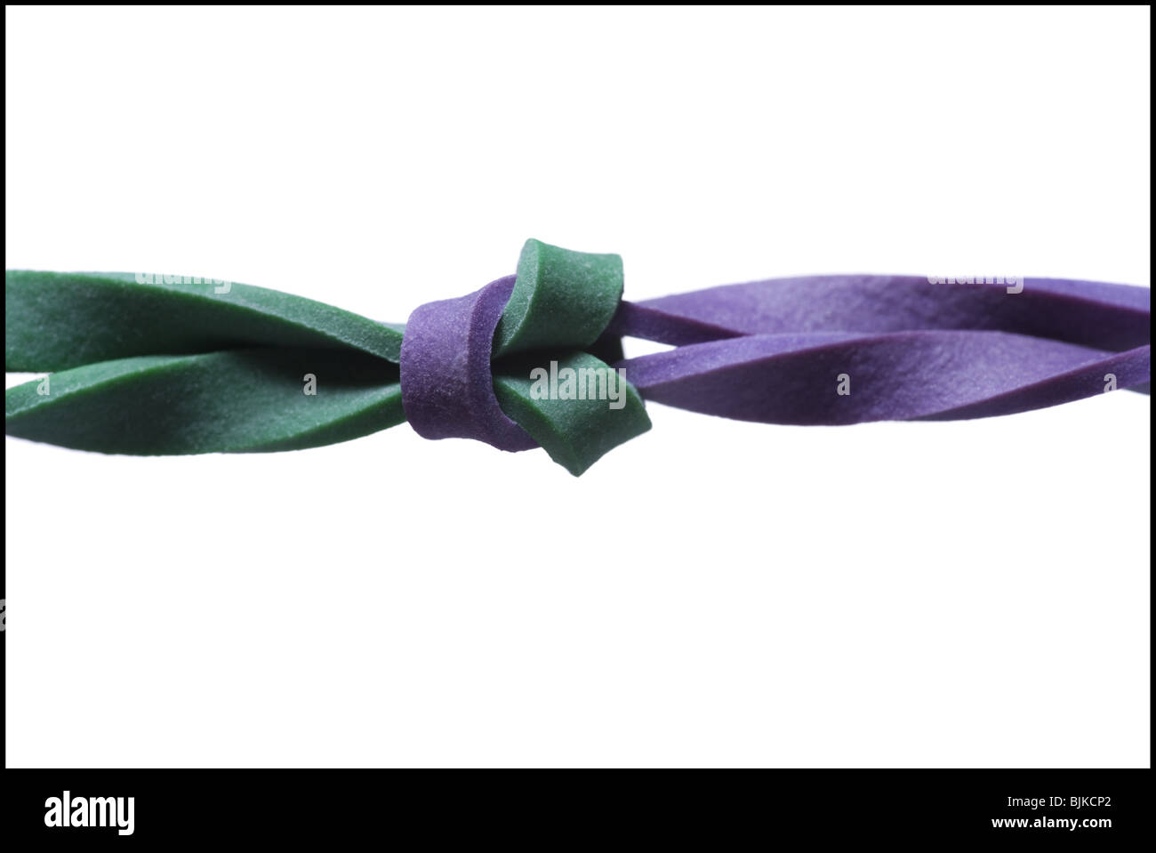 Two elastic bands intertwined Stock Photo - Alamy