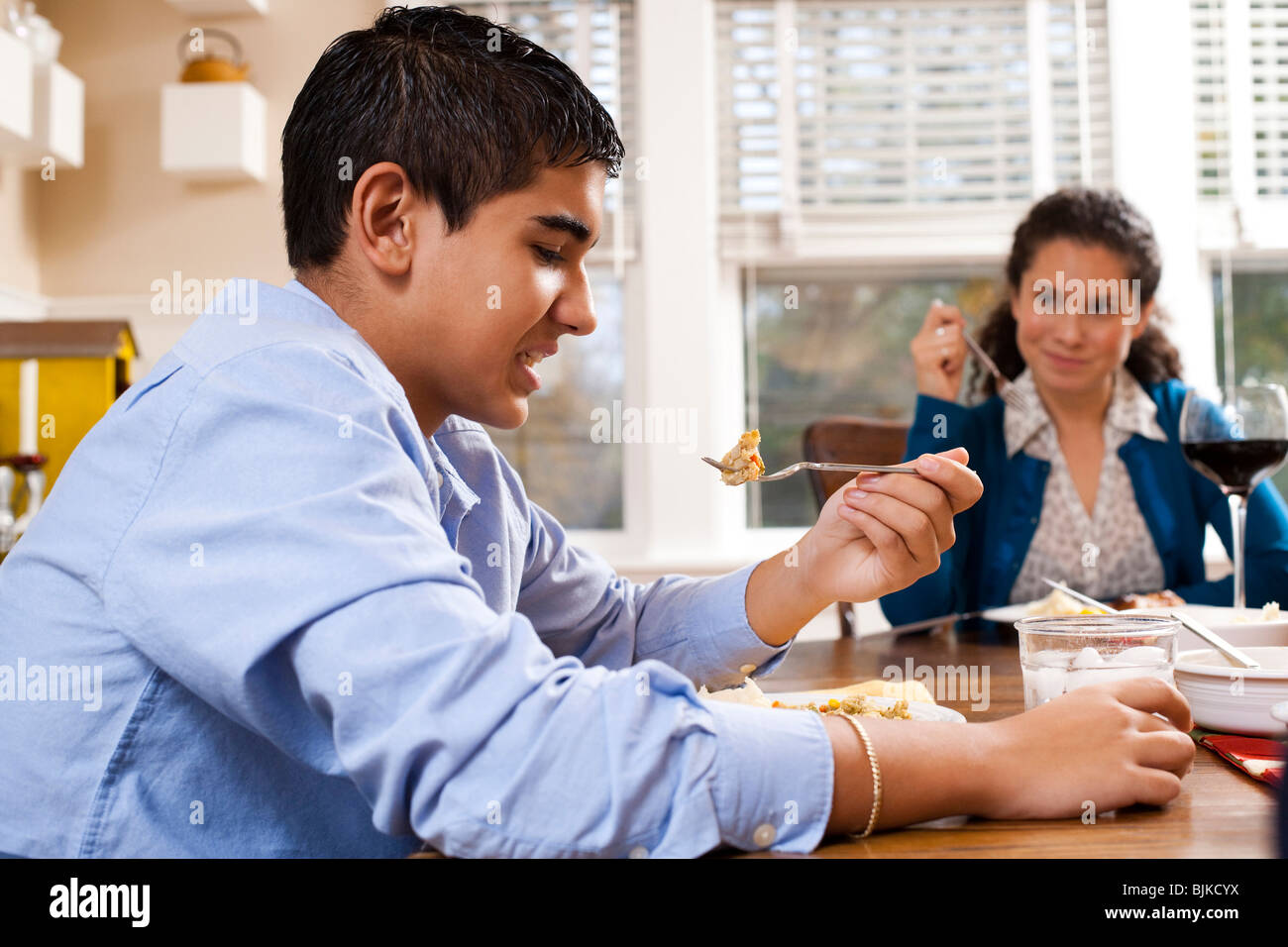 Boy eating green beans Stock Photo - Alamy