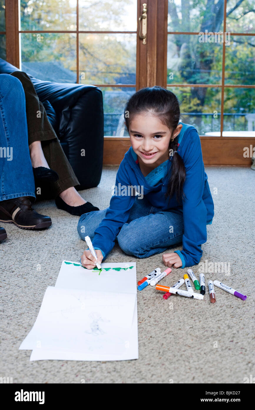 Young girl coloring with markers Stock Photo - Alamy