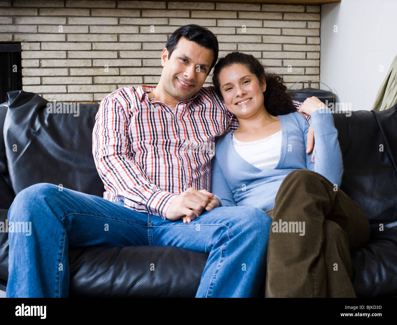 Man and woman snuggling Stock Photo - Alamy