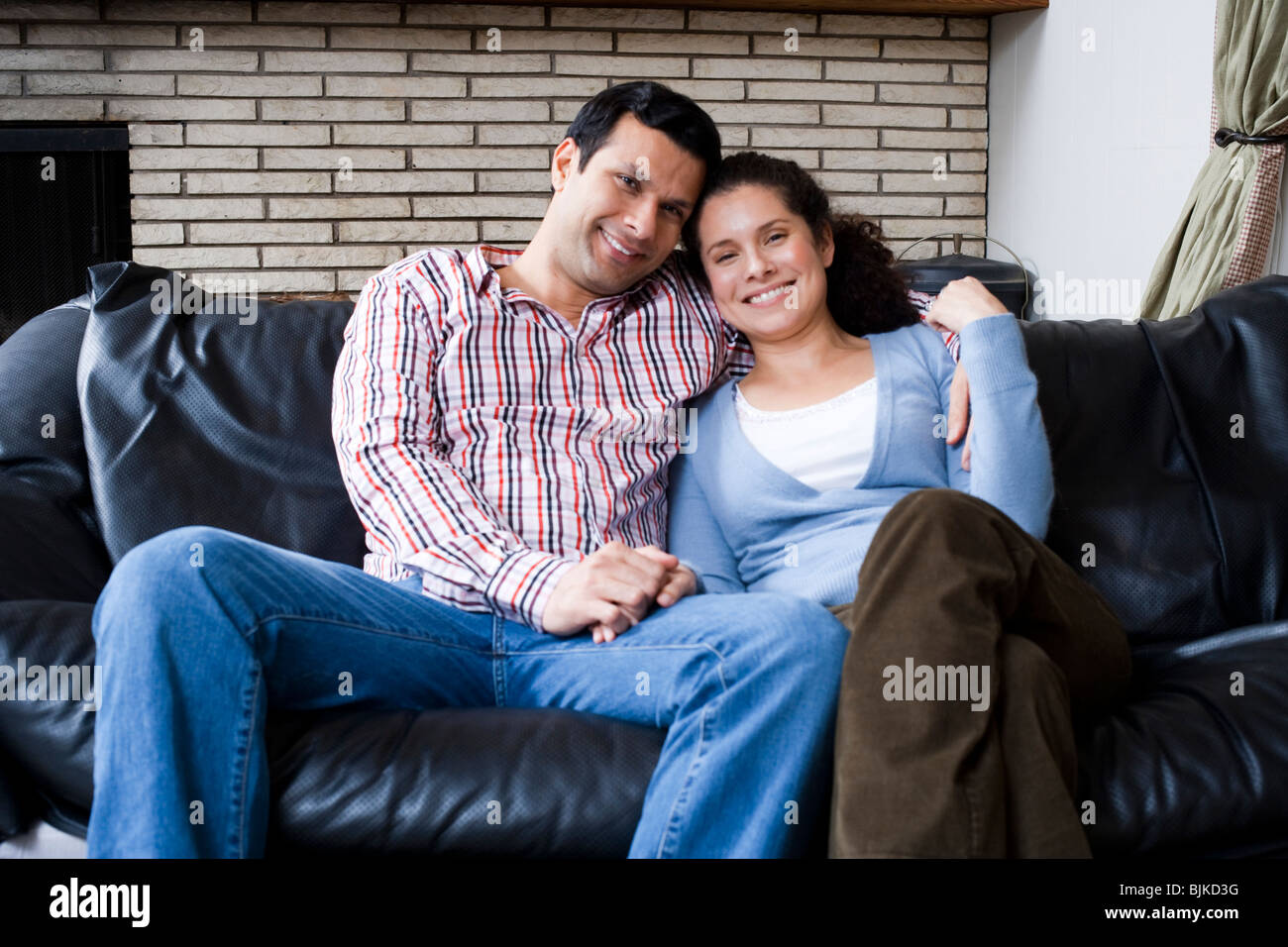 Man and woman snuggling Stock Photo - Alamy