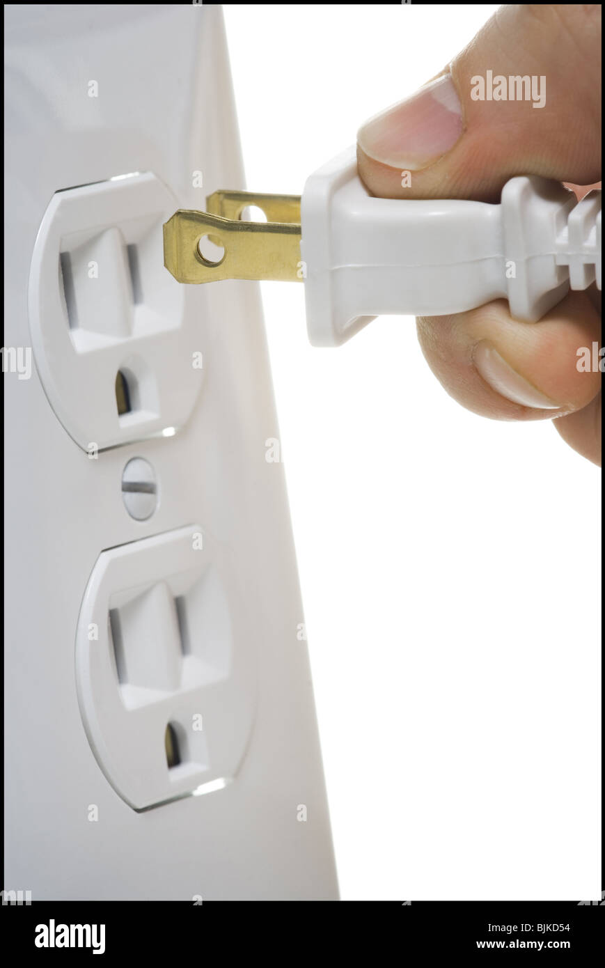 Plug into socket Stock Photo - Alamy