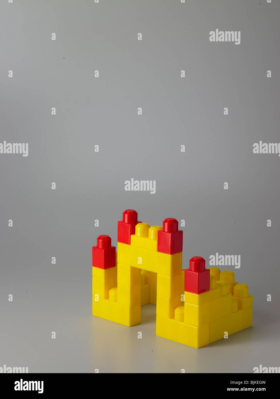 Toy blocks showing building and structure. Portrait format in text ...